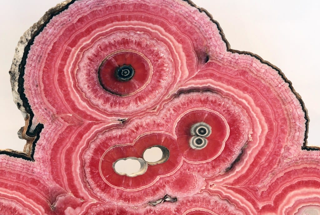 The Power of Rhodochrosite: Unveiling Its Meaning, Uses & Benefits